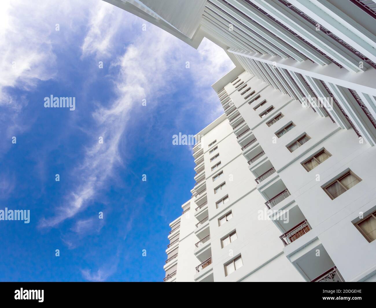 High-rise building and bright blue sky Stock Photo - Alamy