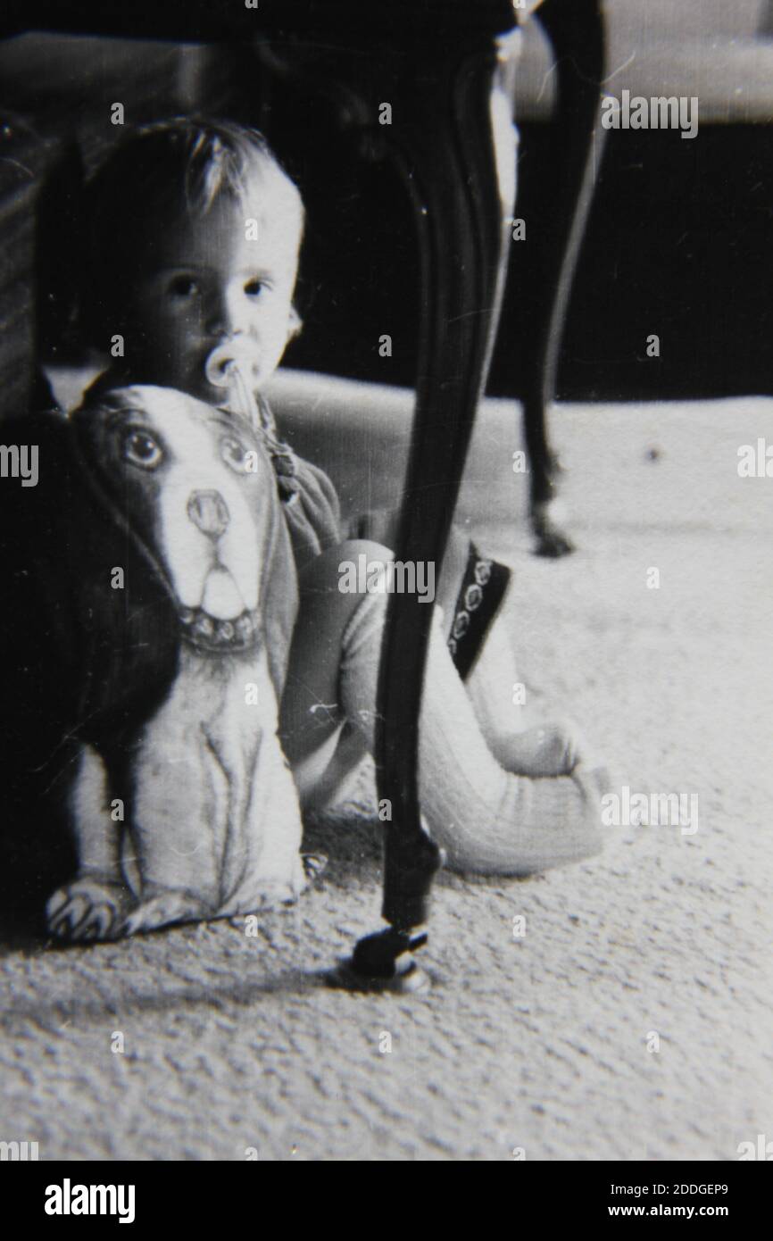 Fine 1970s vintage black and white photography of a little girl sucking ...