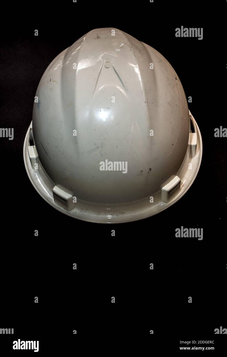 Scratched on the Old Safety helmet on black background Stock Photo - Alamy