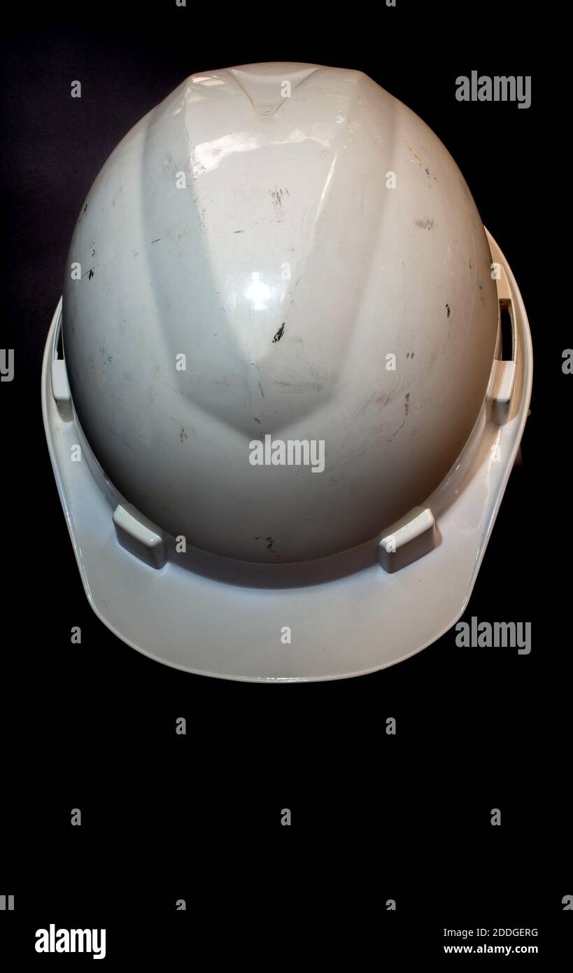 Scratched on the Old Safety helmet on black background Stock Photo - Alamy