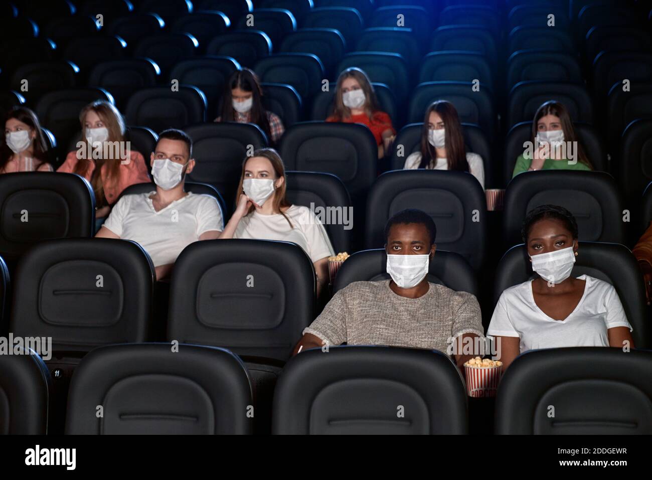 Woman movie theatre looking at camera hi-res stock photography and ...