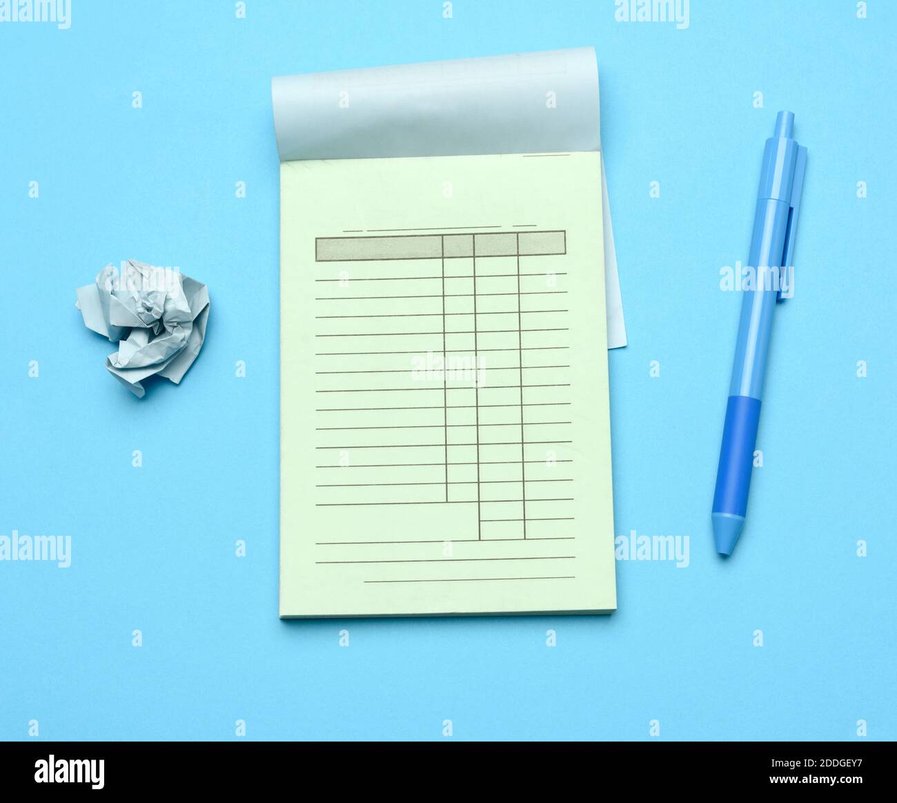 stack of blank blue blank checks on a blue background, business ...