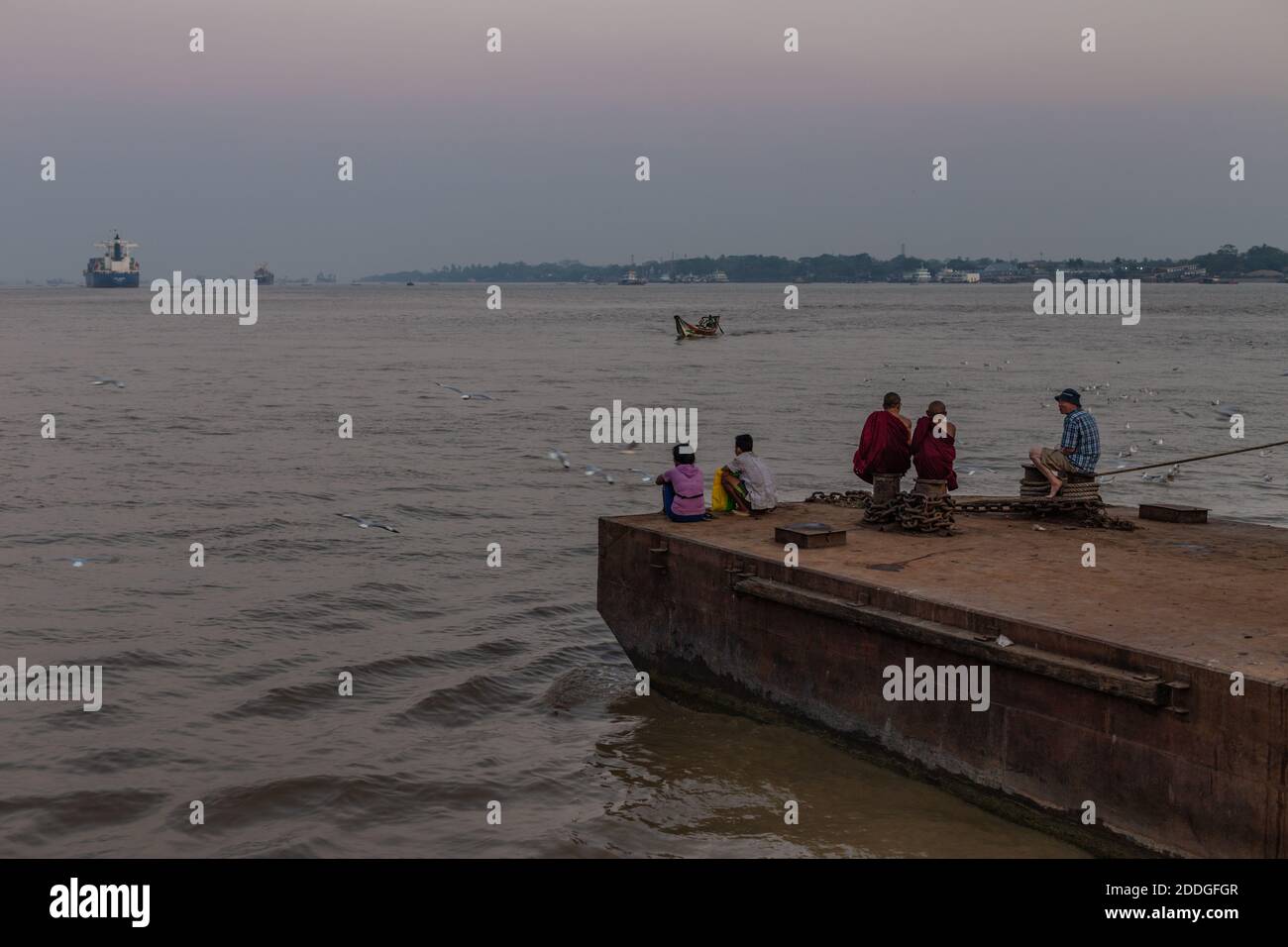 Easing out at the Yangon river Stock Photo - Alamy