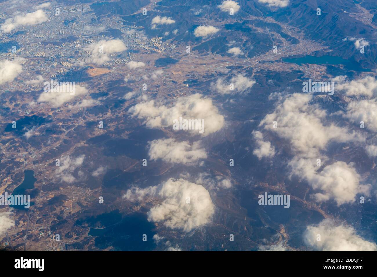 Aerial View of Incheon City with white clouds from a window of ...