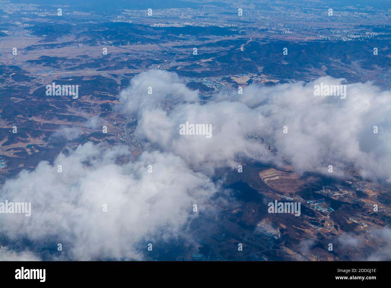 Aerial View of Incheon City with white clouds from a window of ...