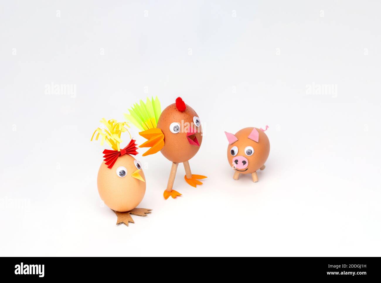 simple figurine for kids made of eggshell and paper, isolated on white ...