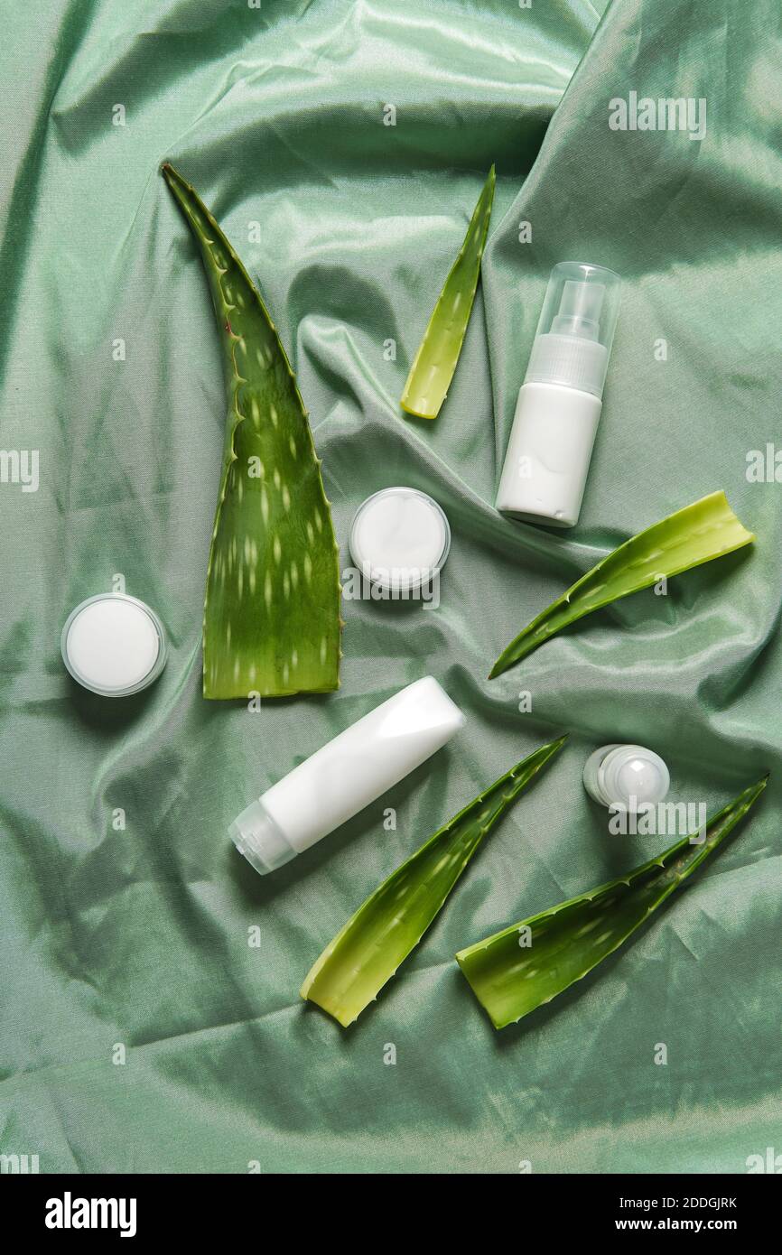 From above of arrangement of aloe vera leaves and various cosmetic ...