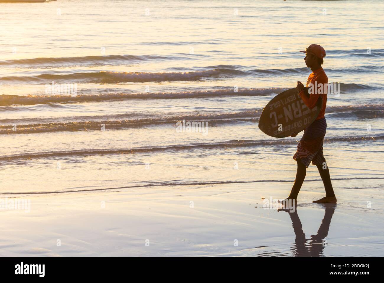 A skimboarder at the beach in Boracay Island, Philippines Stock Photo ...