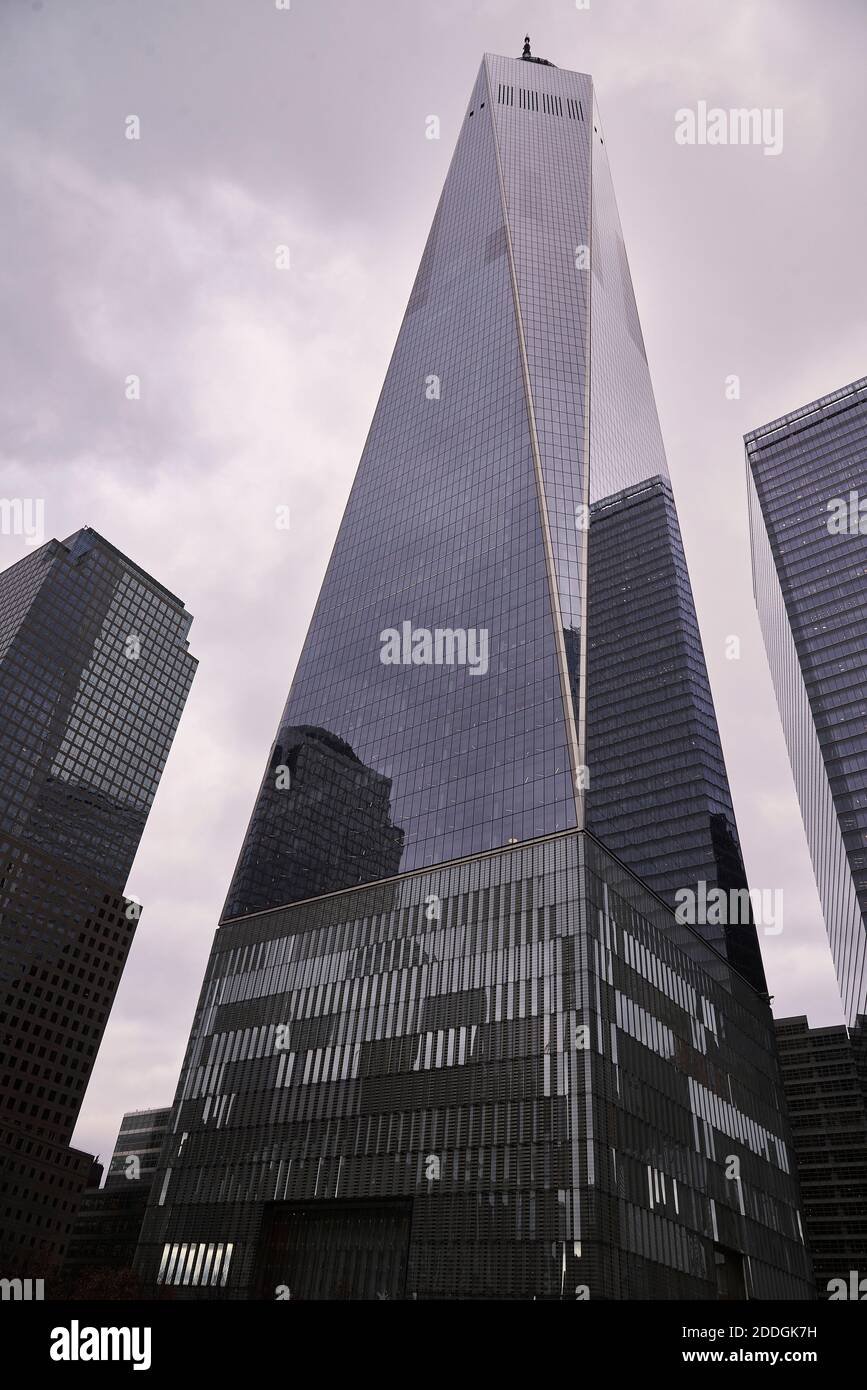From below of futuristic multistory building with glass facade located ...
