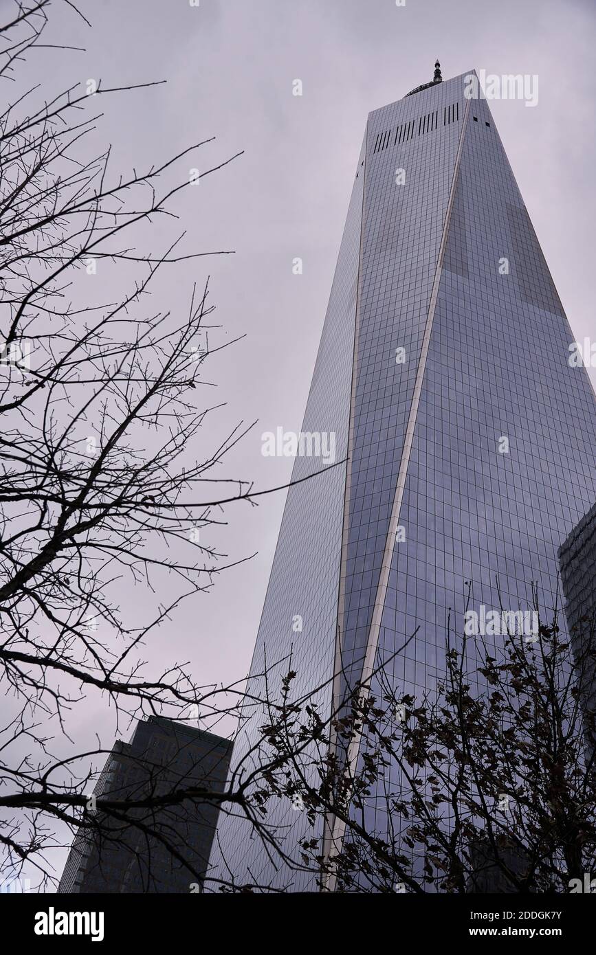 From below of futuristic multistory building with glass facade located ...