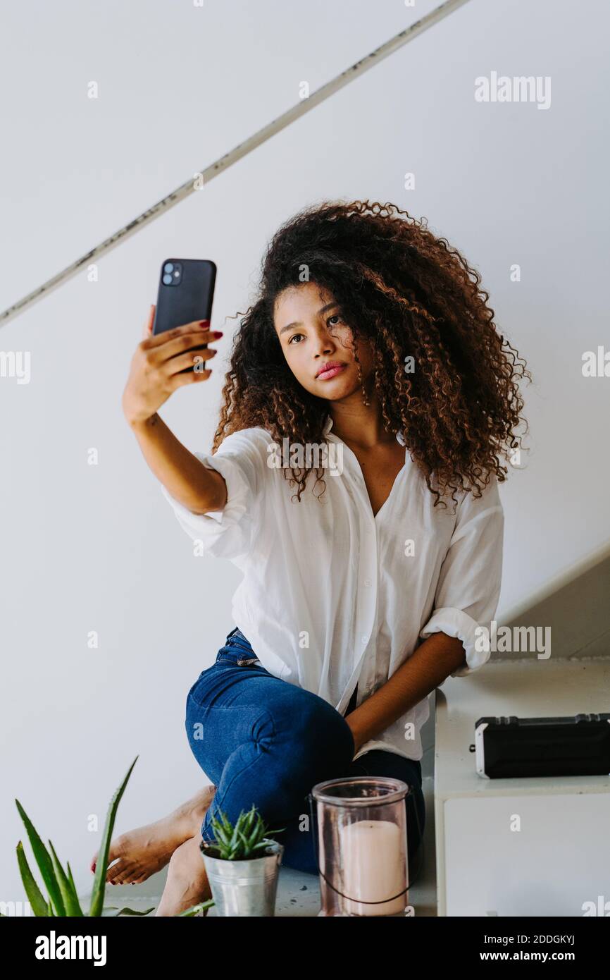 Delighted gay male putting on colorful sunglasses with rainbow LGBT ...