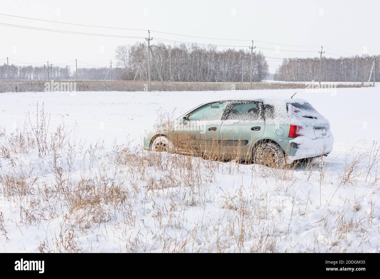 Winter, people and car problem concept. Danger of getting stuck in snow ...