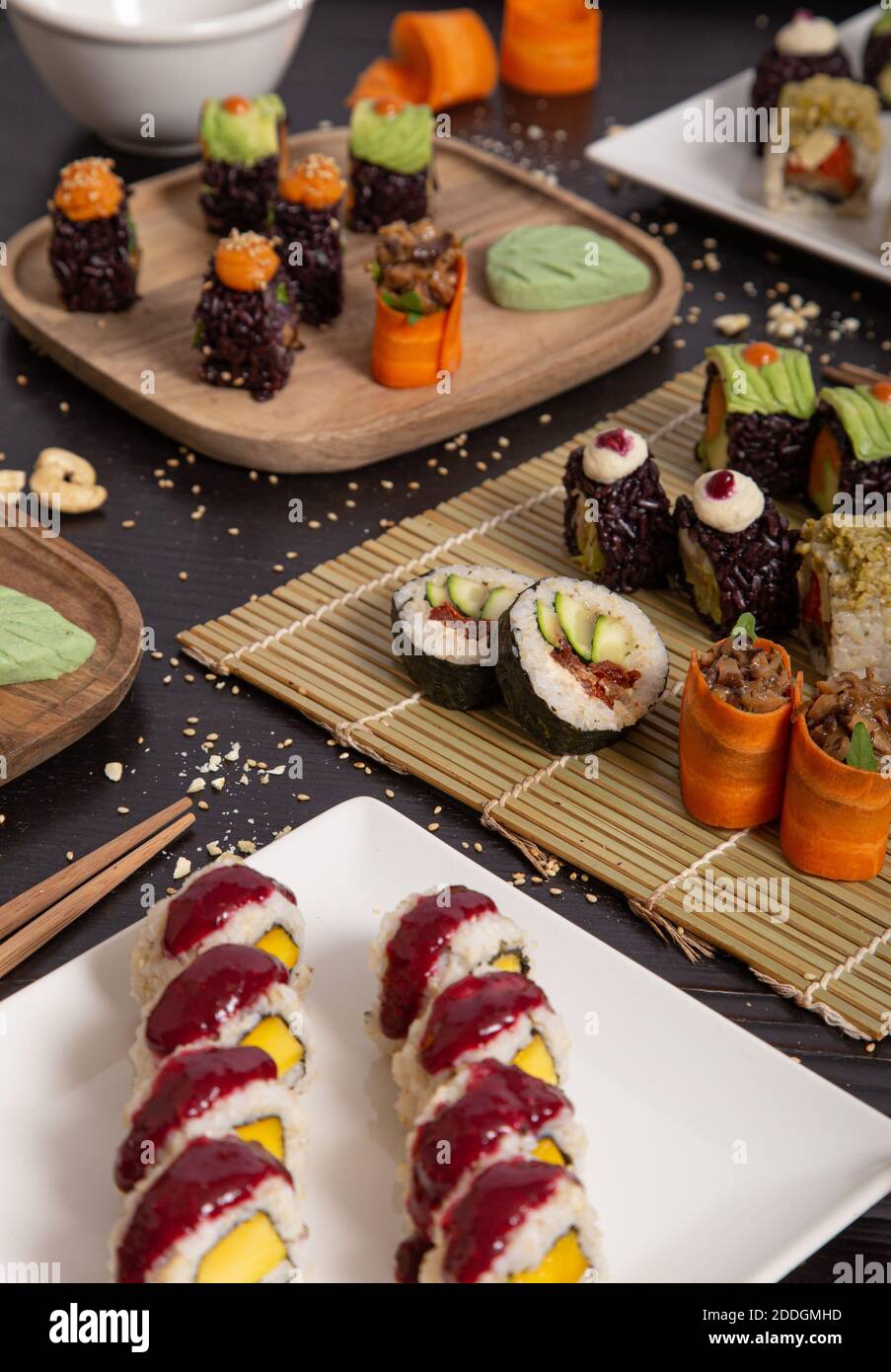 From above of arrangement of delicious veggie rolls on plates and ...