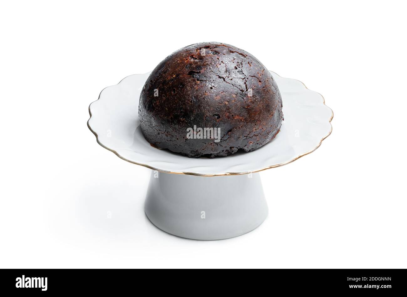 Traditional festive christmas pudding on porcelain cake stand isolated ...