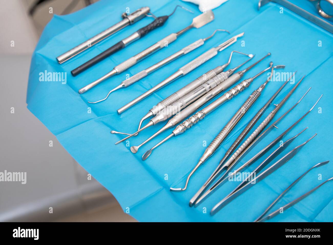 From above of set of various metal tool of sterile table placed in row ...