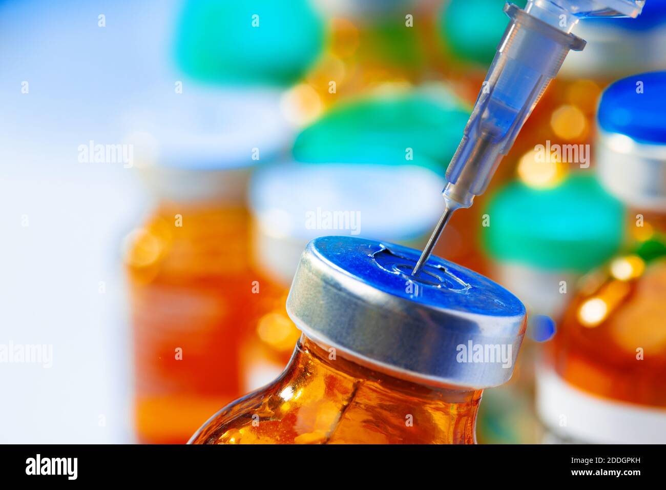 Medical vial with medication and syringe close up Stock Photo - Alamy