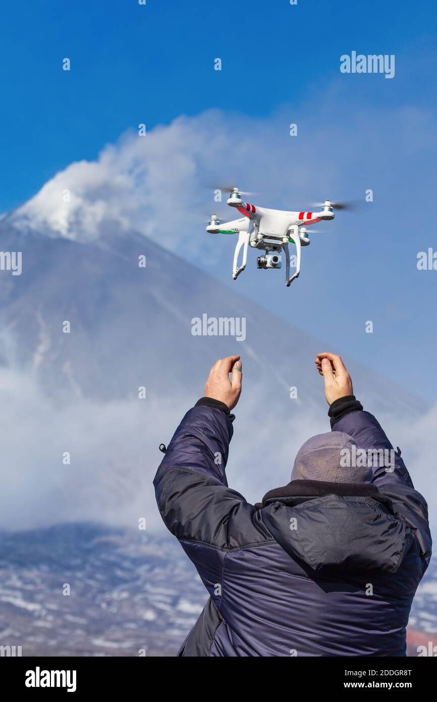 Male launches flying drone quadcopter UAV with digital camera on ...