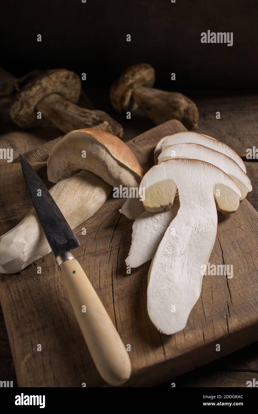 From above composition of raw whole and sliced porcini or cep mushrooms ...