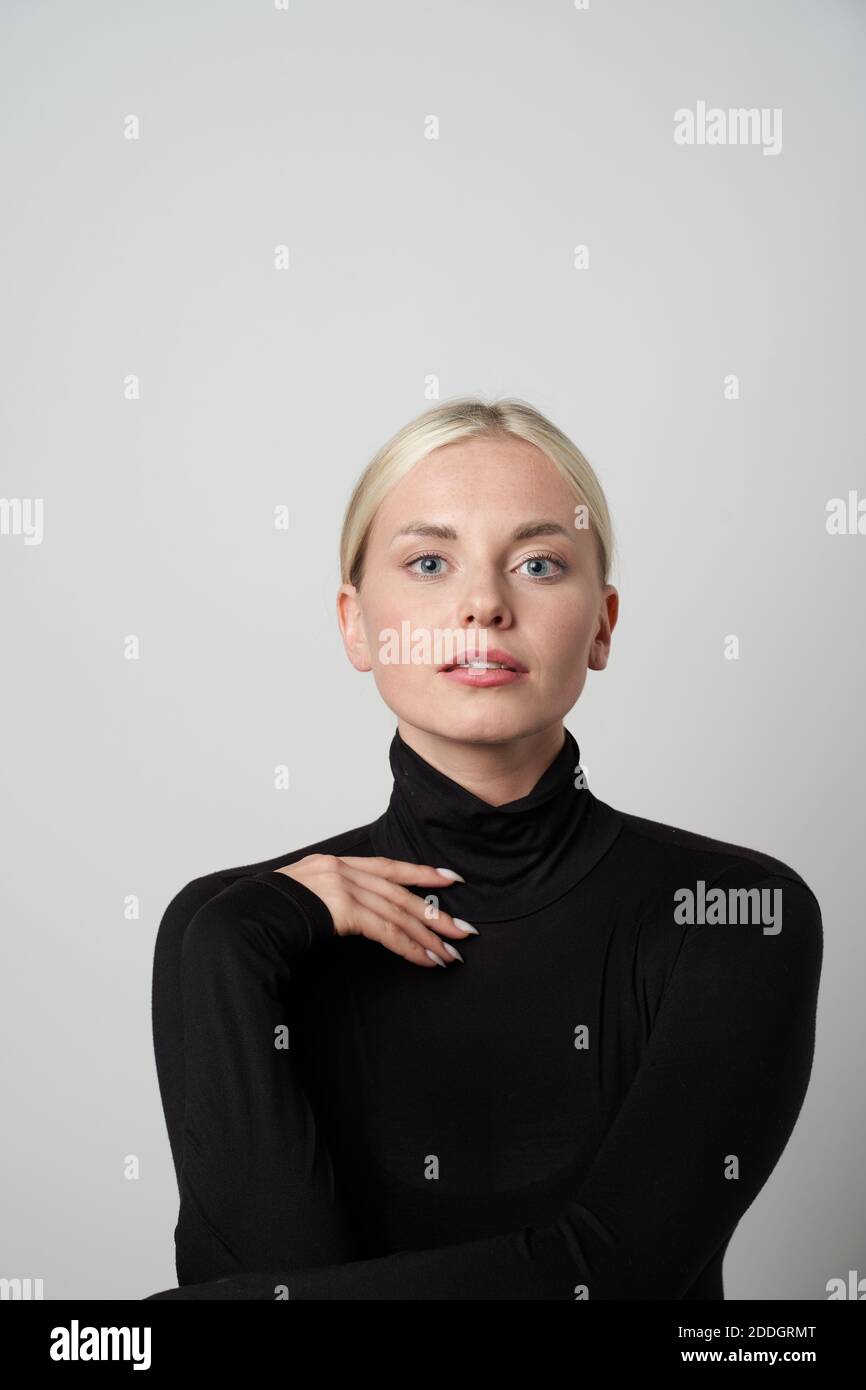 Stock photo of young female doctor taking notes in her video call with ...