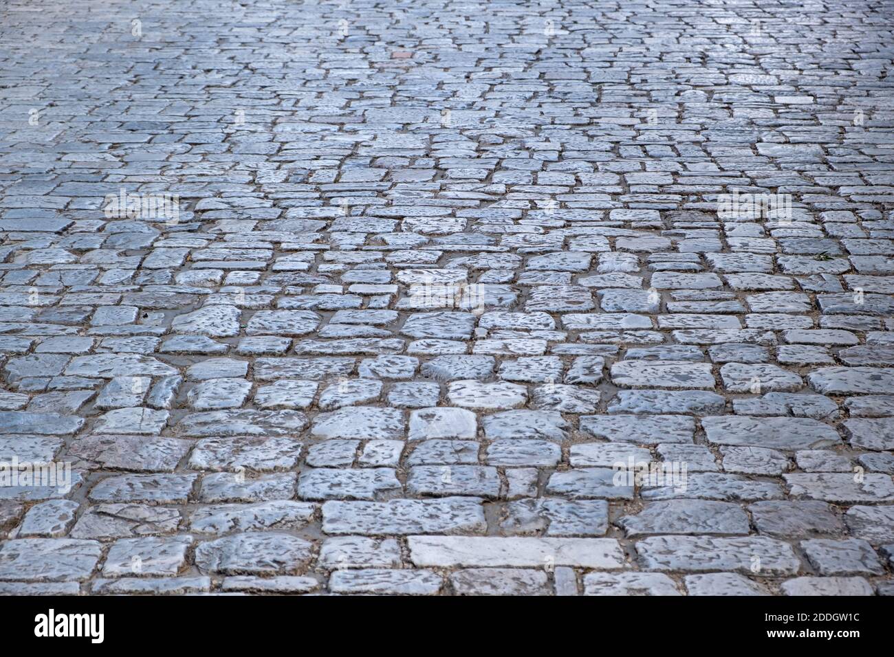 Old stone marble paved footpath, cobblestone background, texture ...