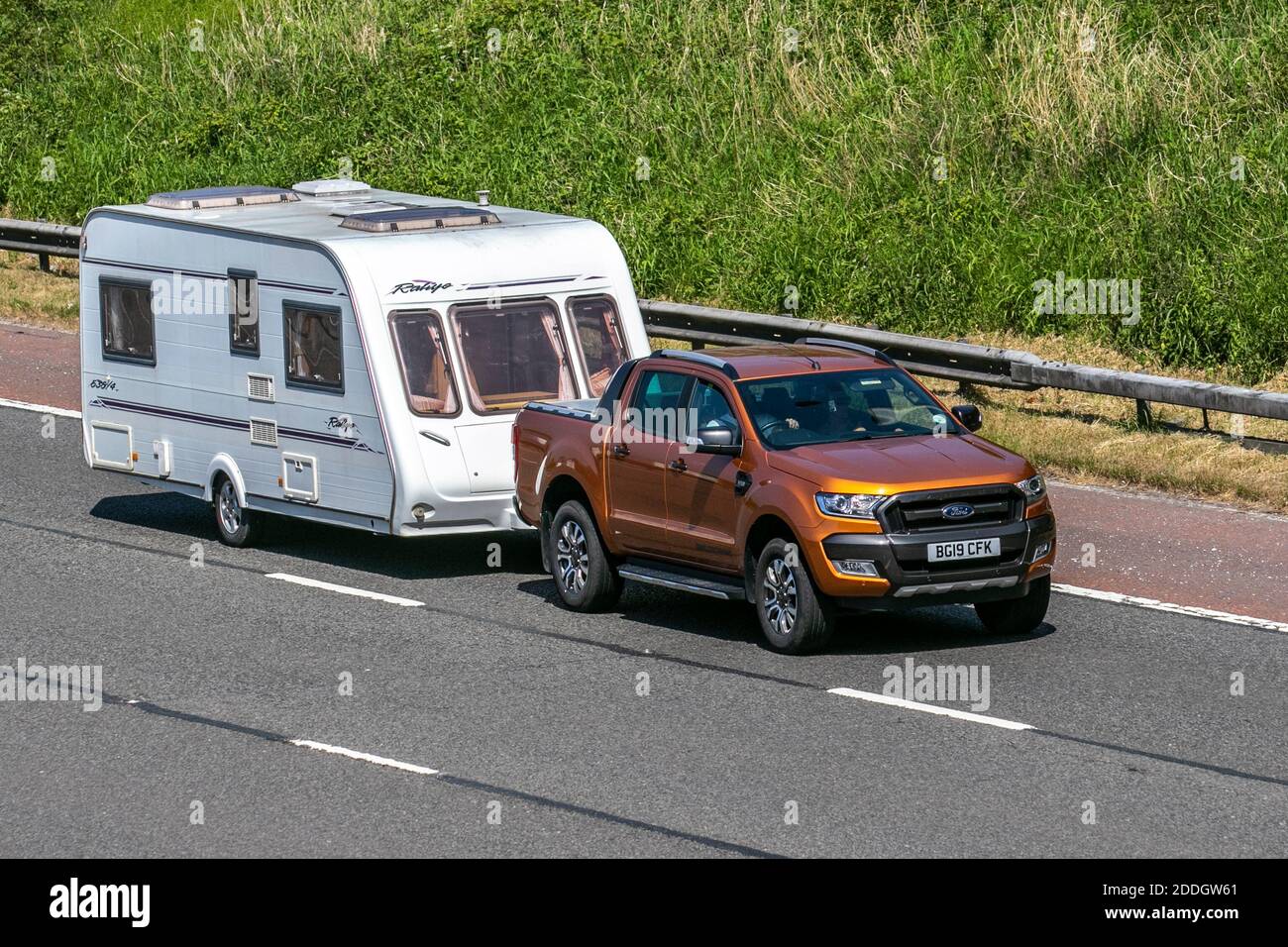2019 orange Ford Ranger Wildtrak 4X4 DCB T towing caravan; Vehicular ...