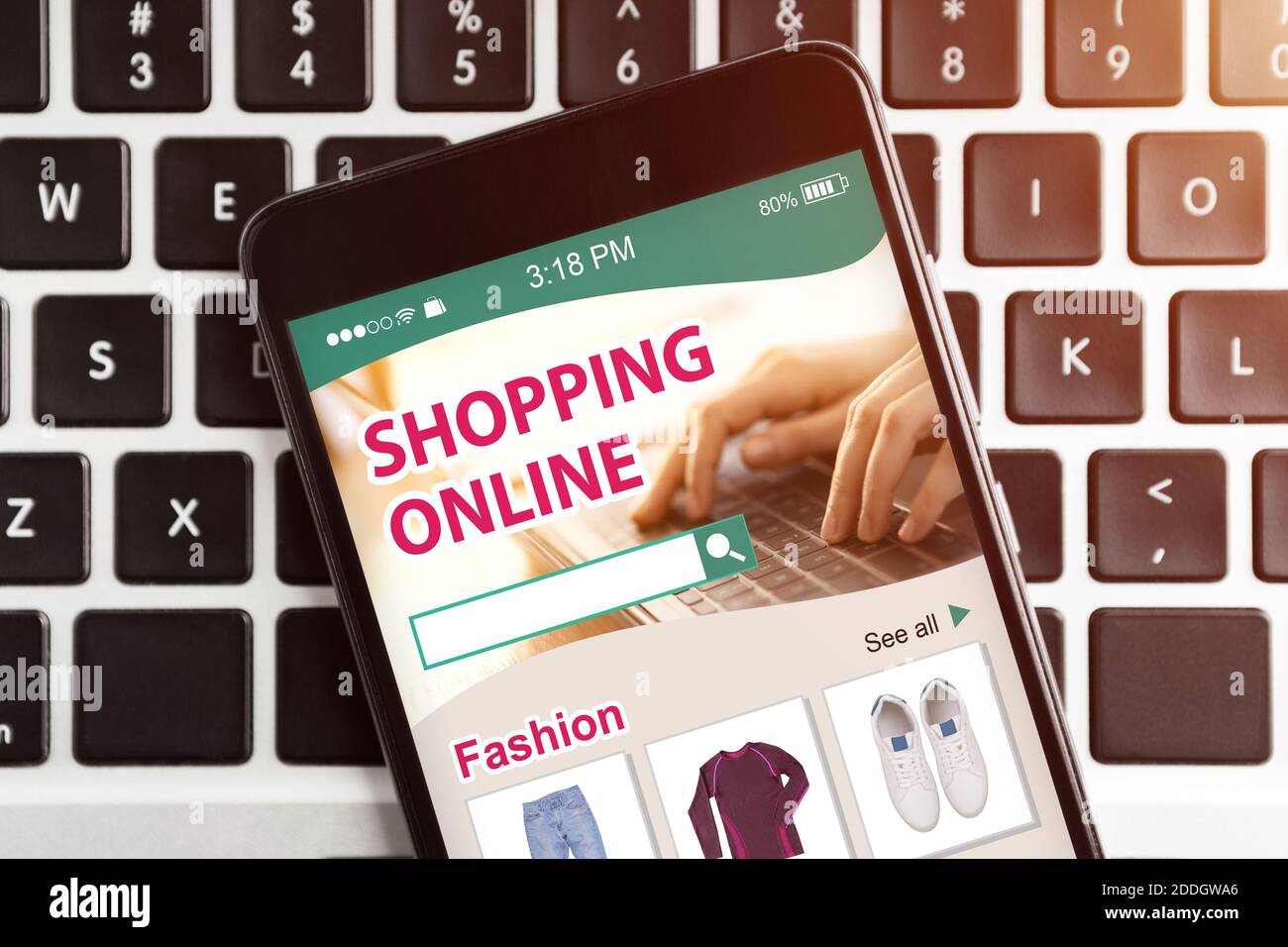 Mobile Phone With Online Shopping App Lying On Computer Keyboard Stock ...