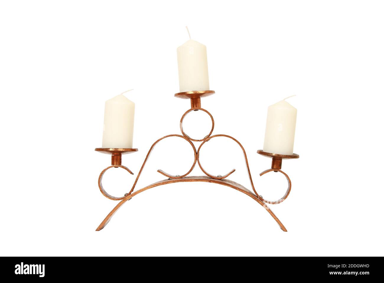 A decorative metal candle holder with three candles isolated on a white ...