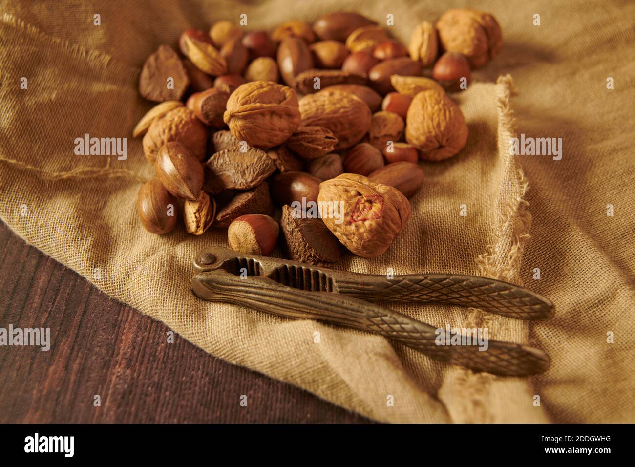 Mixed nuts in their shells with vintage nut crackers , England, Uk, Gb ...