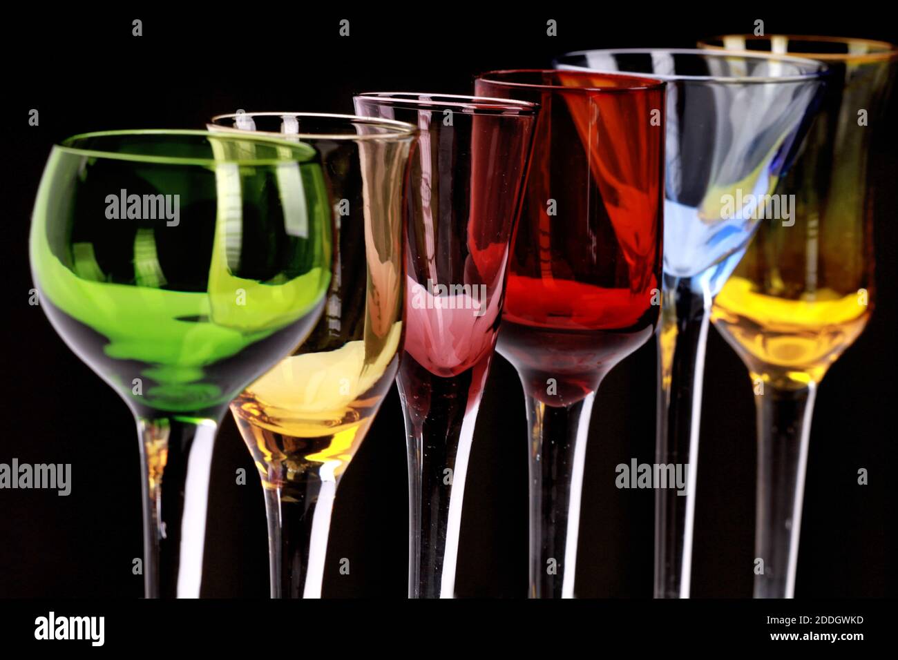 A colorful glassware collection isolated on a black background Stock ...