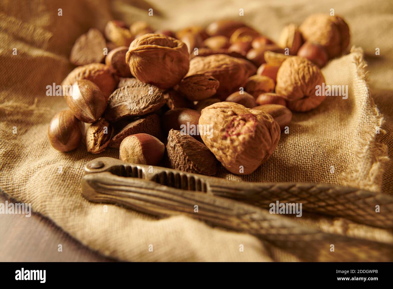 Mixed nuts in their shells with vintage nut crackers , England, Uk, Gb ...