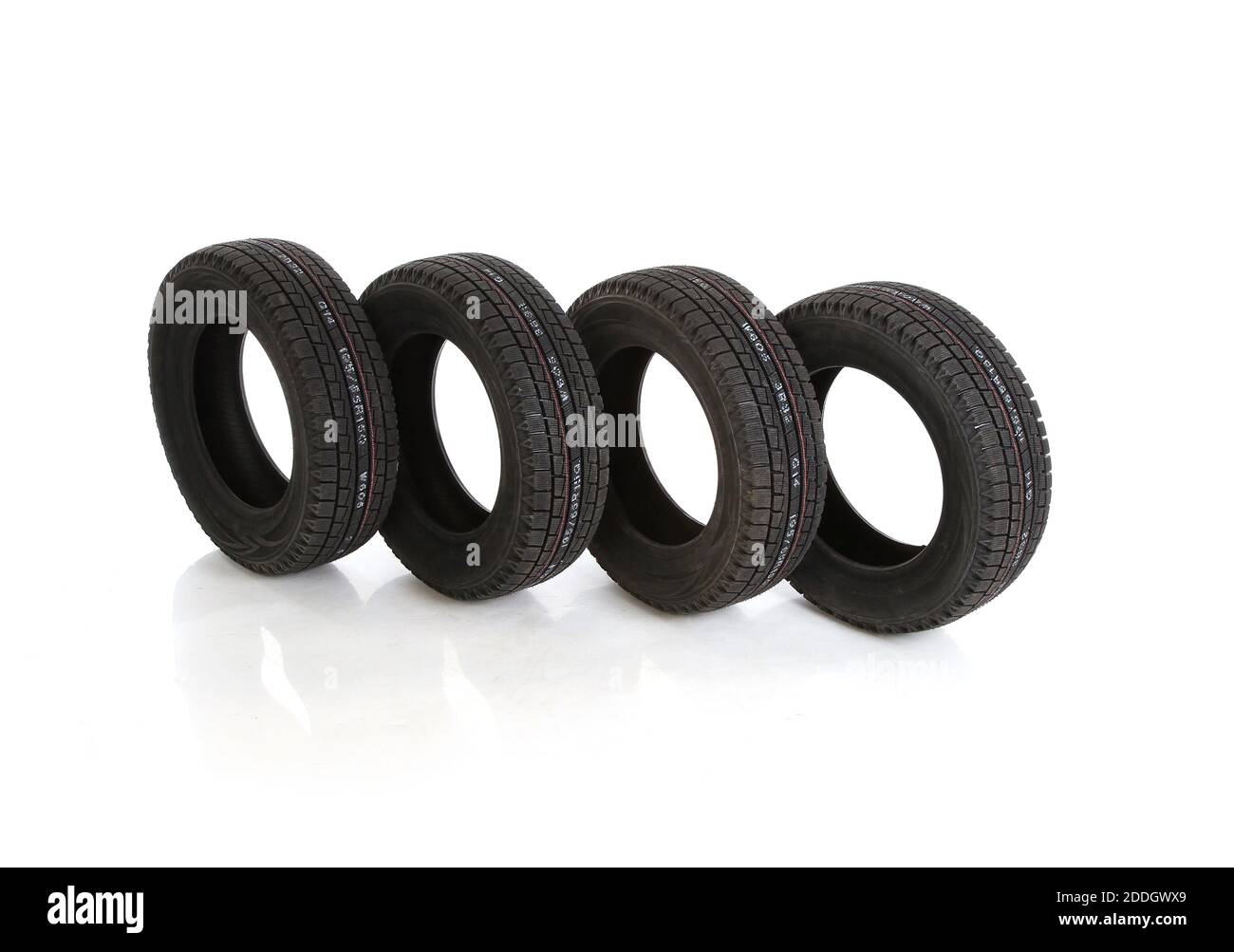 A stack of car tires isolated on a white background Stock Photo - Alamy