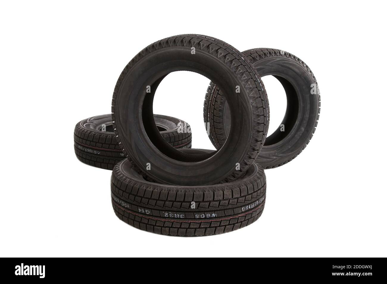 A stack of car tires isolated on a white background Stock Photo - Alamy