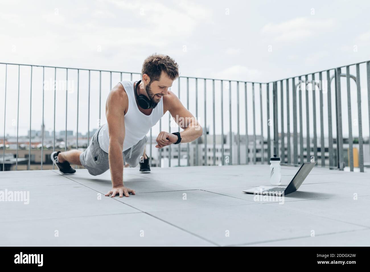Outdoor health and fitness workout on a rooftop terrace Stock Photo - Alamy