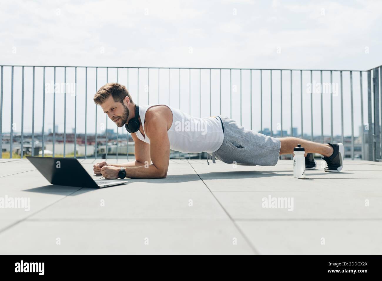 Outdoor health and fitness workout on a rooftop terrace Stock Photo - Alamy