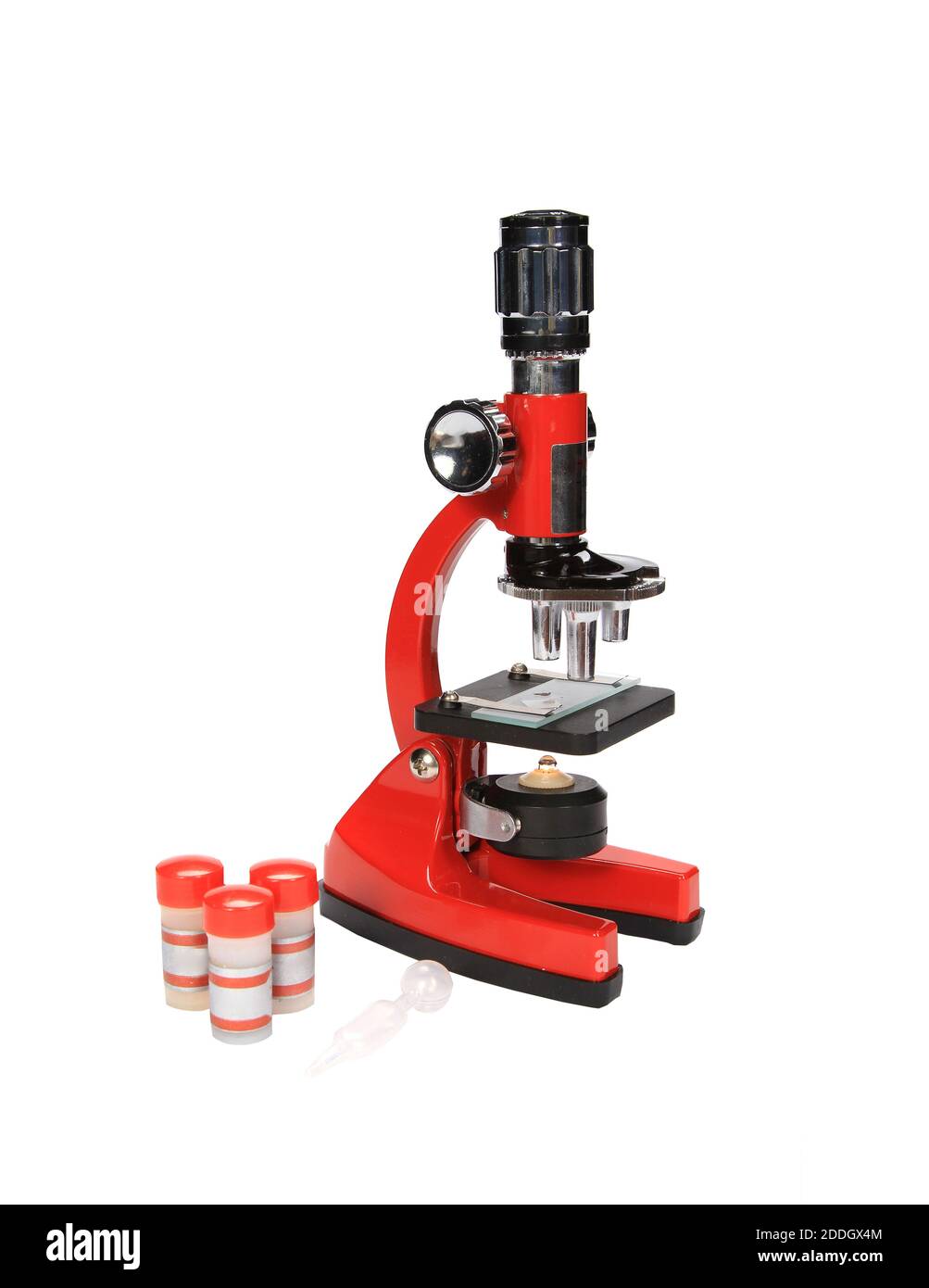 A vertical shot of a red microscope with different lenses isolated on a ...