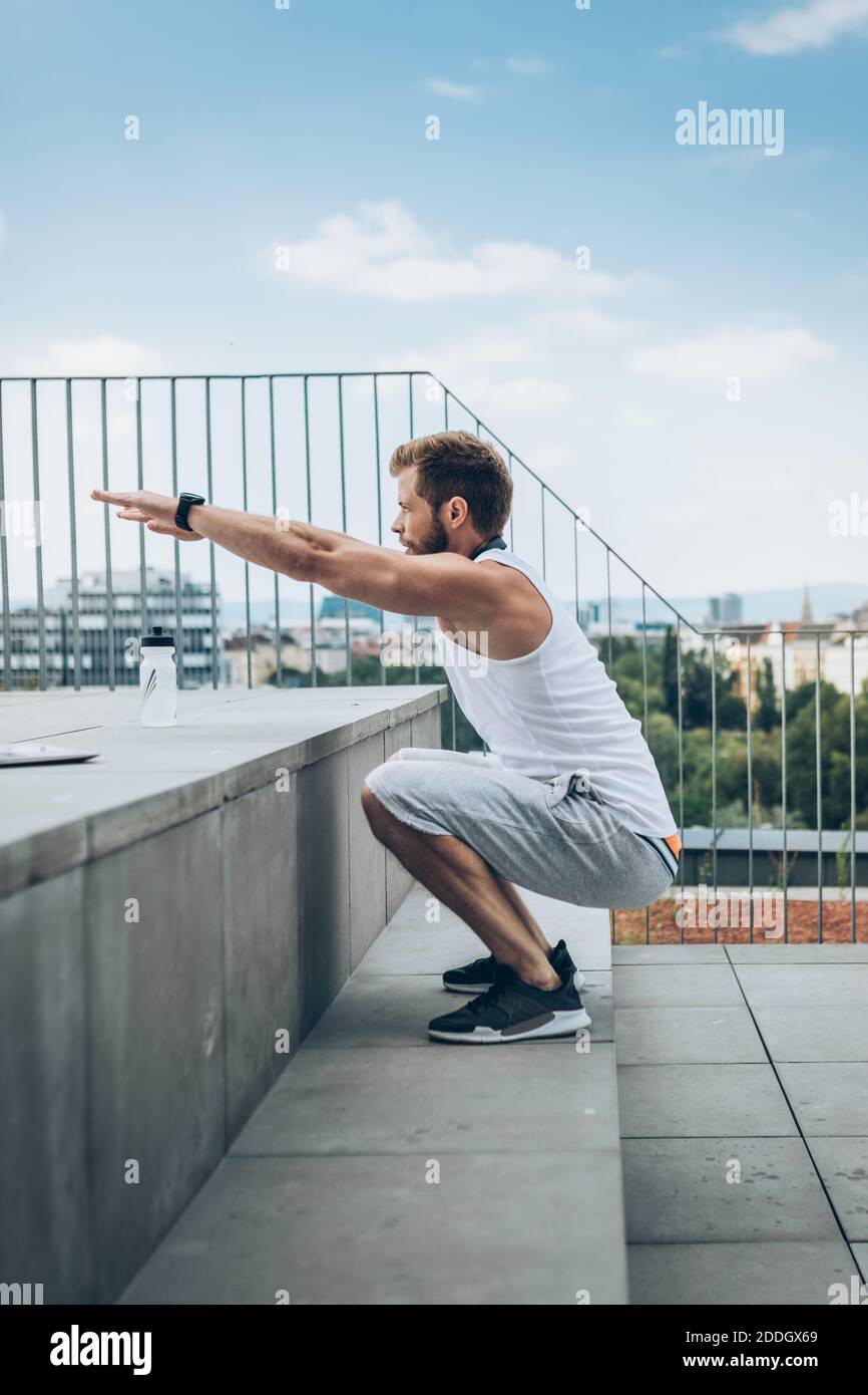 Outdoor health and fitness workout on a rooftop terrace Stock Photo - Alamy