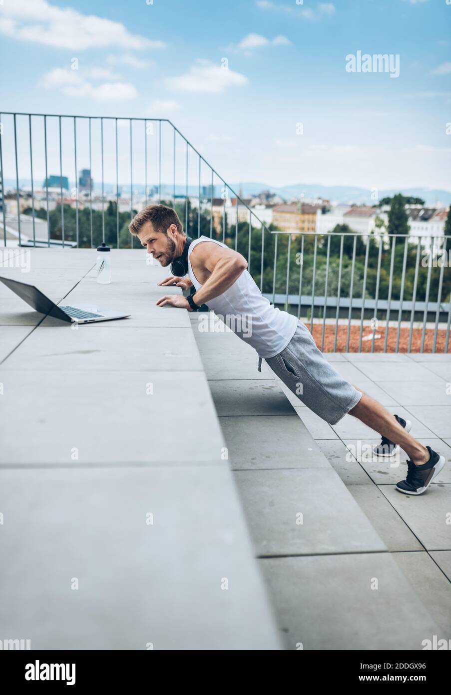 Outdoor health and fitness workout on a rooftop terrace Stock Photo - Alamy
