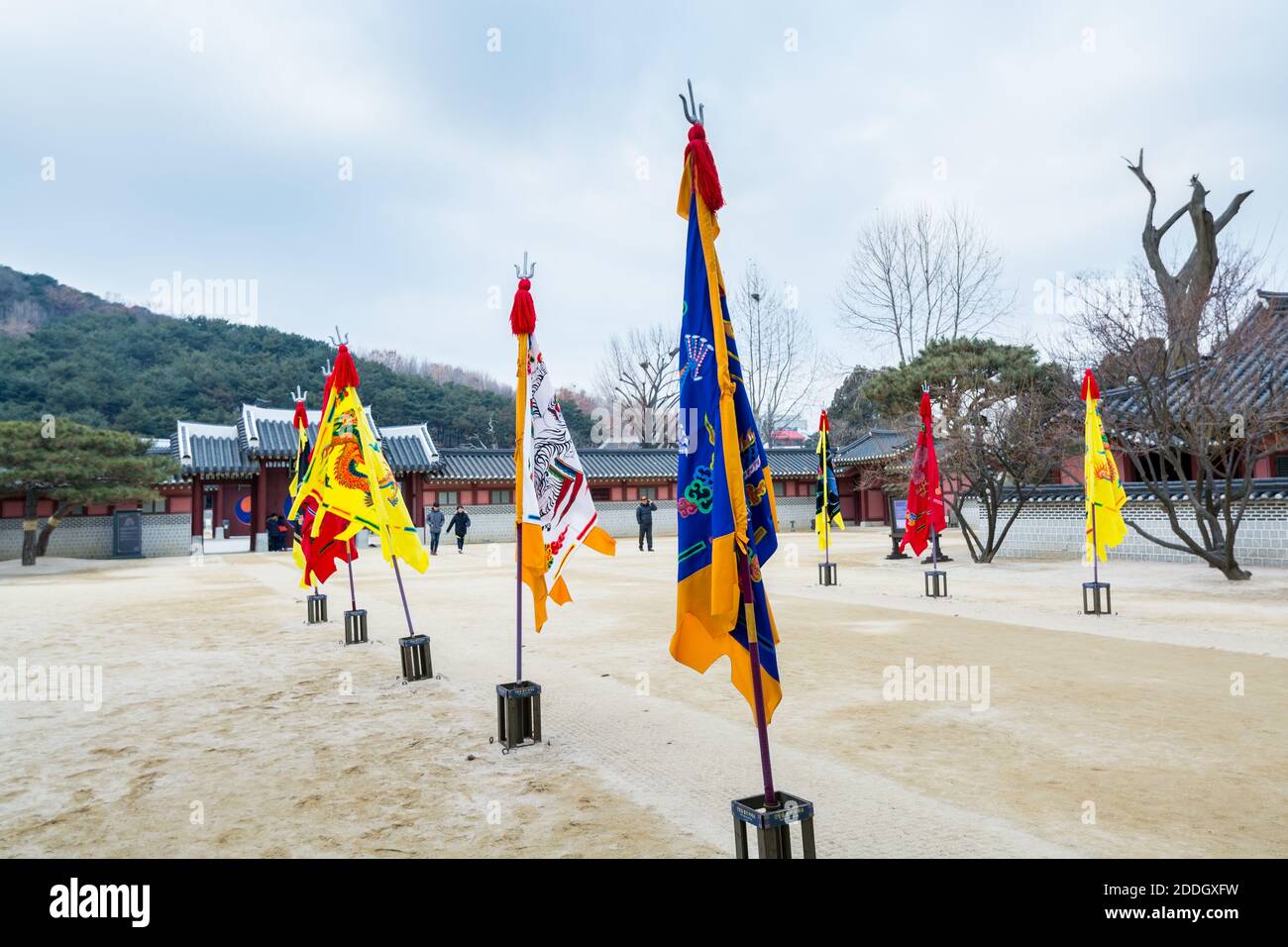 Colorful flags at the Hwaseong Haenggung Palace against cloudy sky in ...