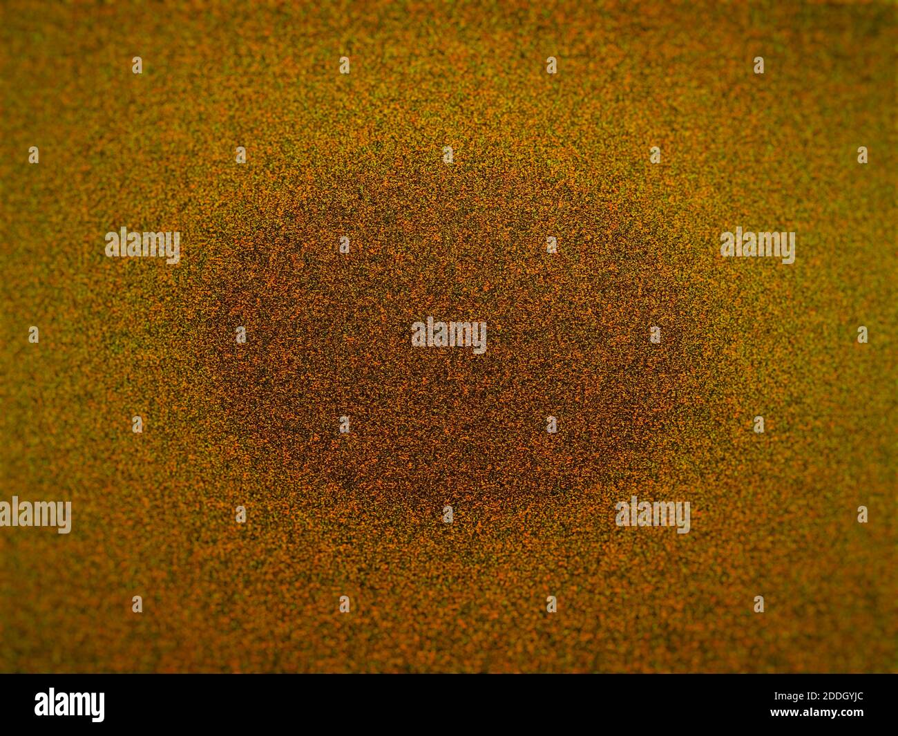 A yellow shaded static film grain background Stock Photo - Alamy