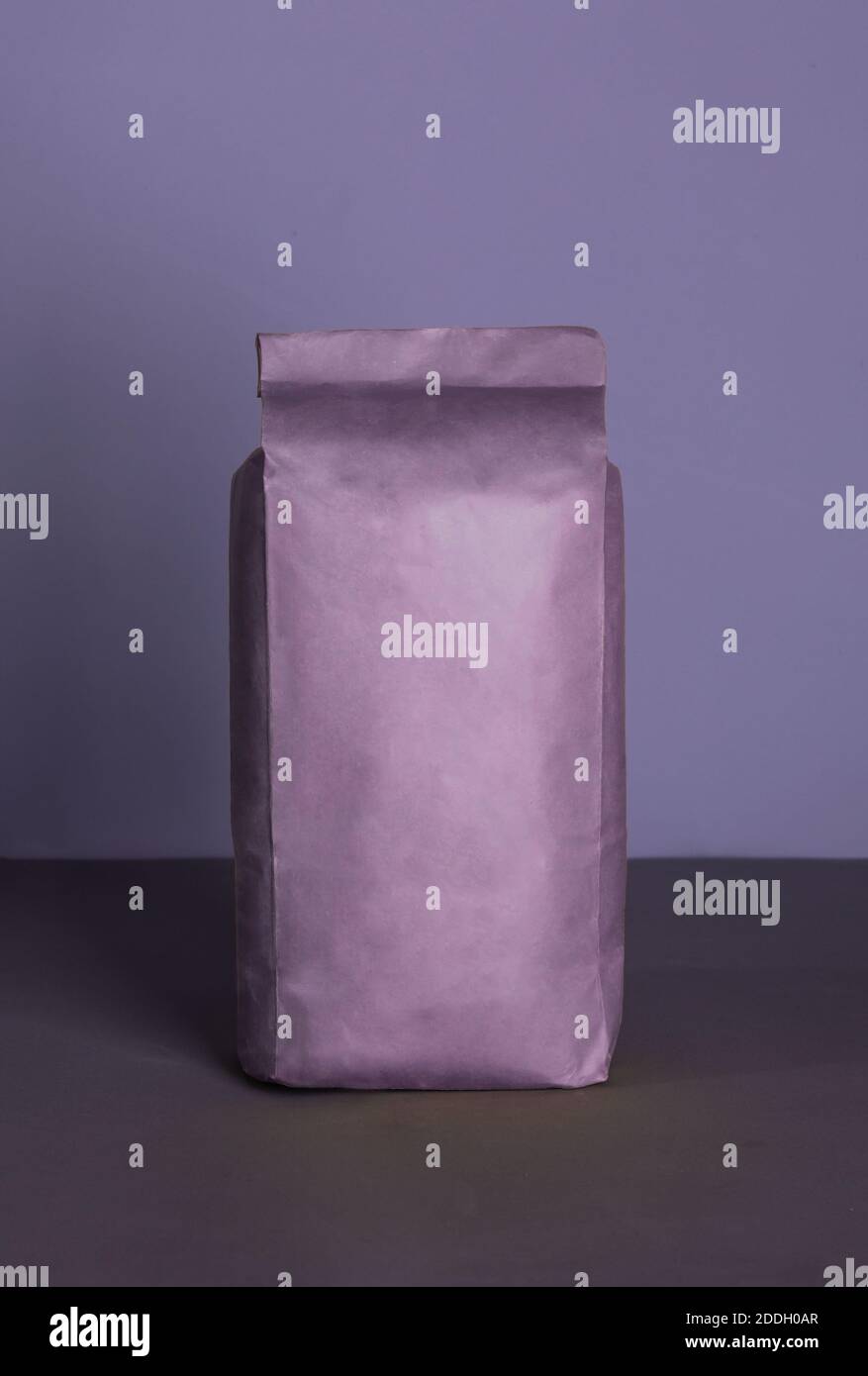 Small blank bulky purple package with product on a purple-lilac ...