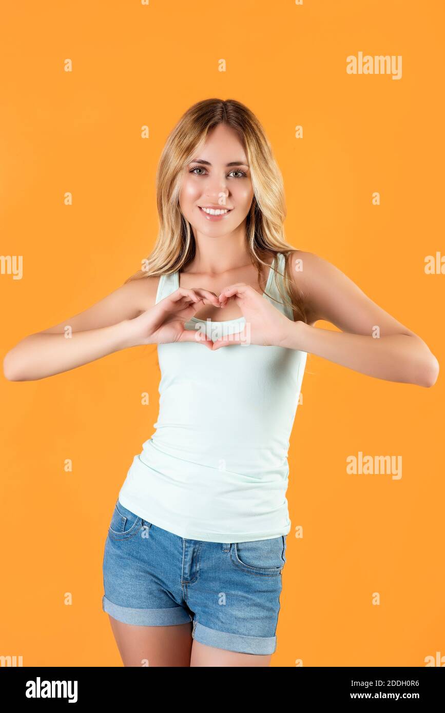 Girl doing hands heart hi-res stock photography and images - Alamy