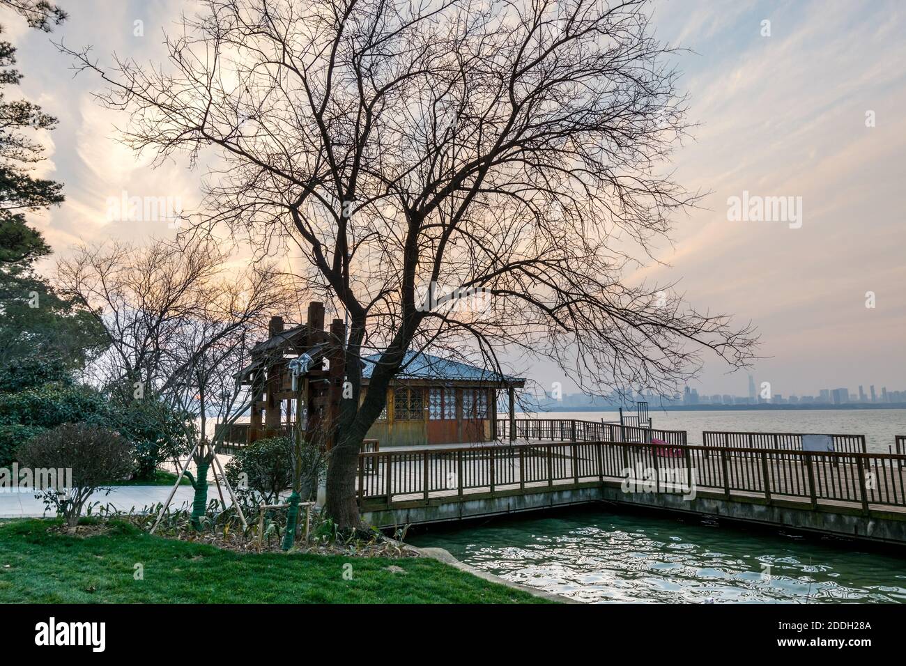 Wooden house and tree in the winter, lake and twilight at the Donghu ...