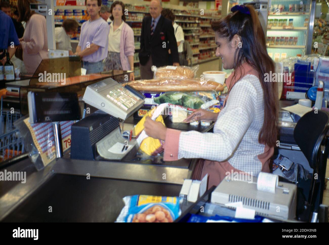 Supermarket Checkout Employee Scanning Barcodes Surrey England Stock ...