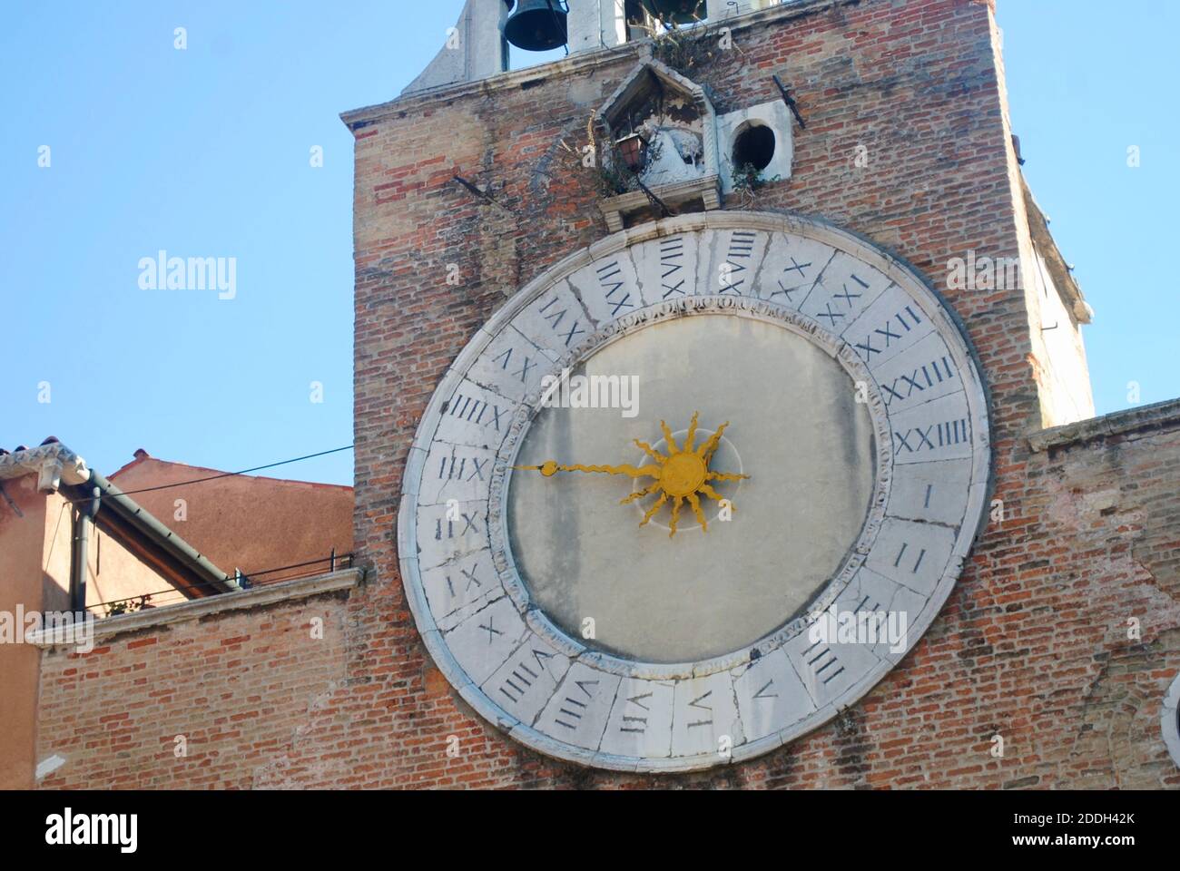 roman numeral clock on building Stock Photo - Alamy