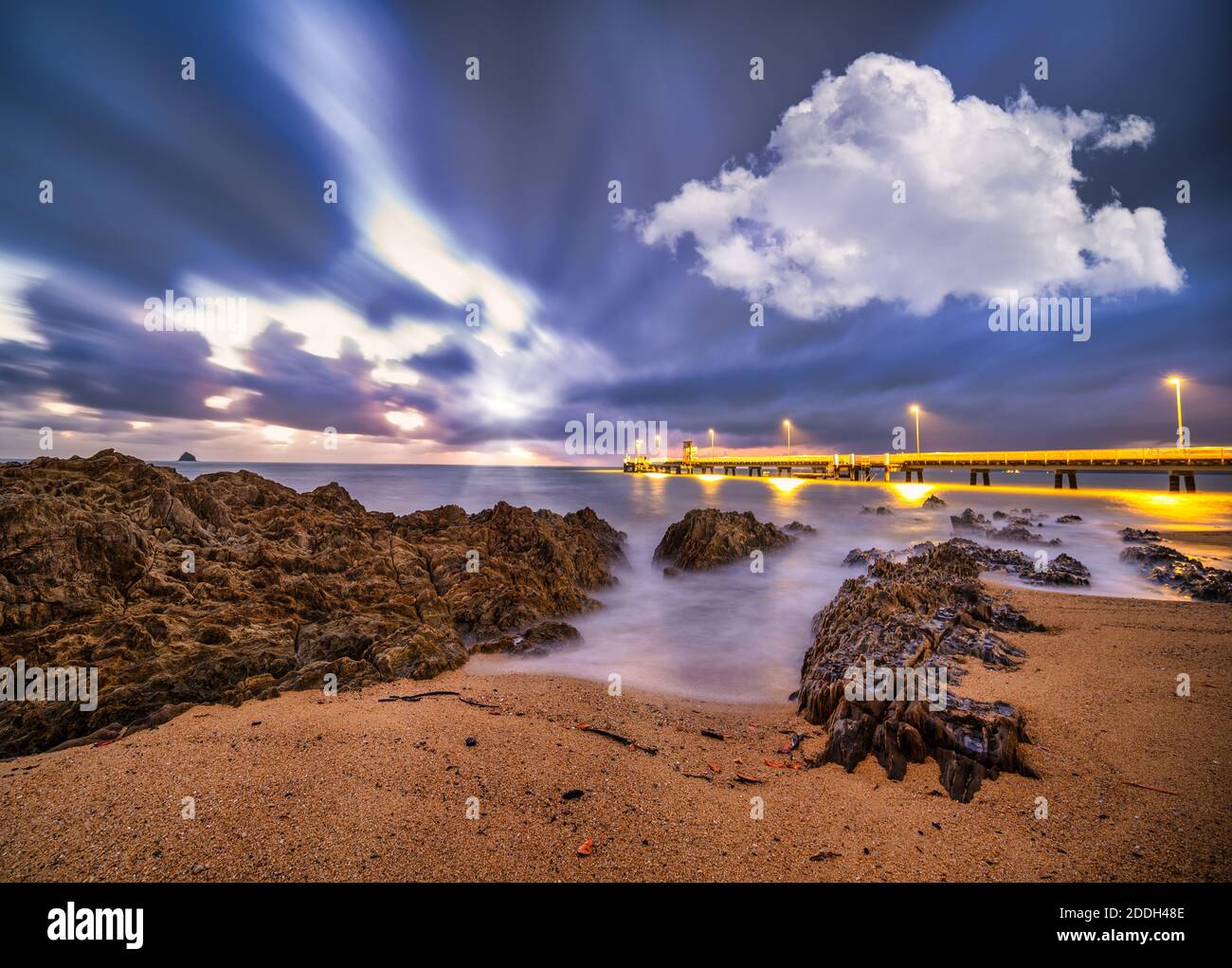 The Palm Cove Jetty under the lights over the sea with long exposure in ...
