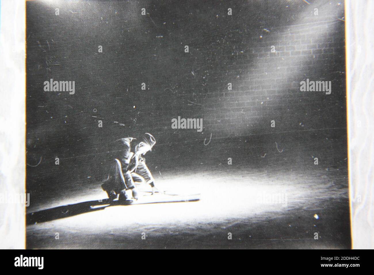 Fine 1970s vintage black and white photography of a regular guy bending ...