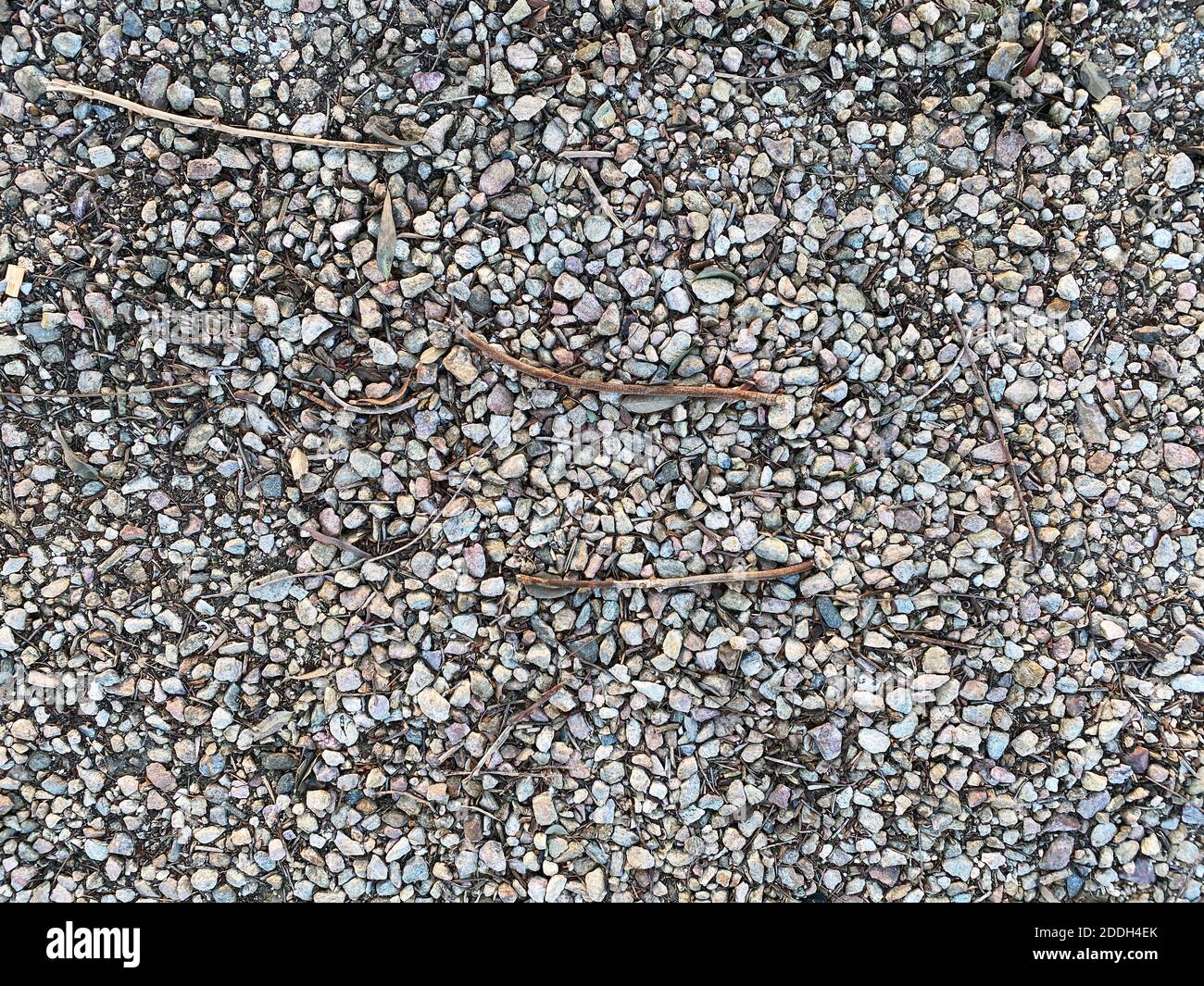 small pebble stone rocks path sticks overhead view with deep shadows ...