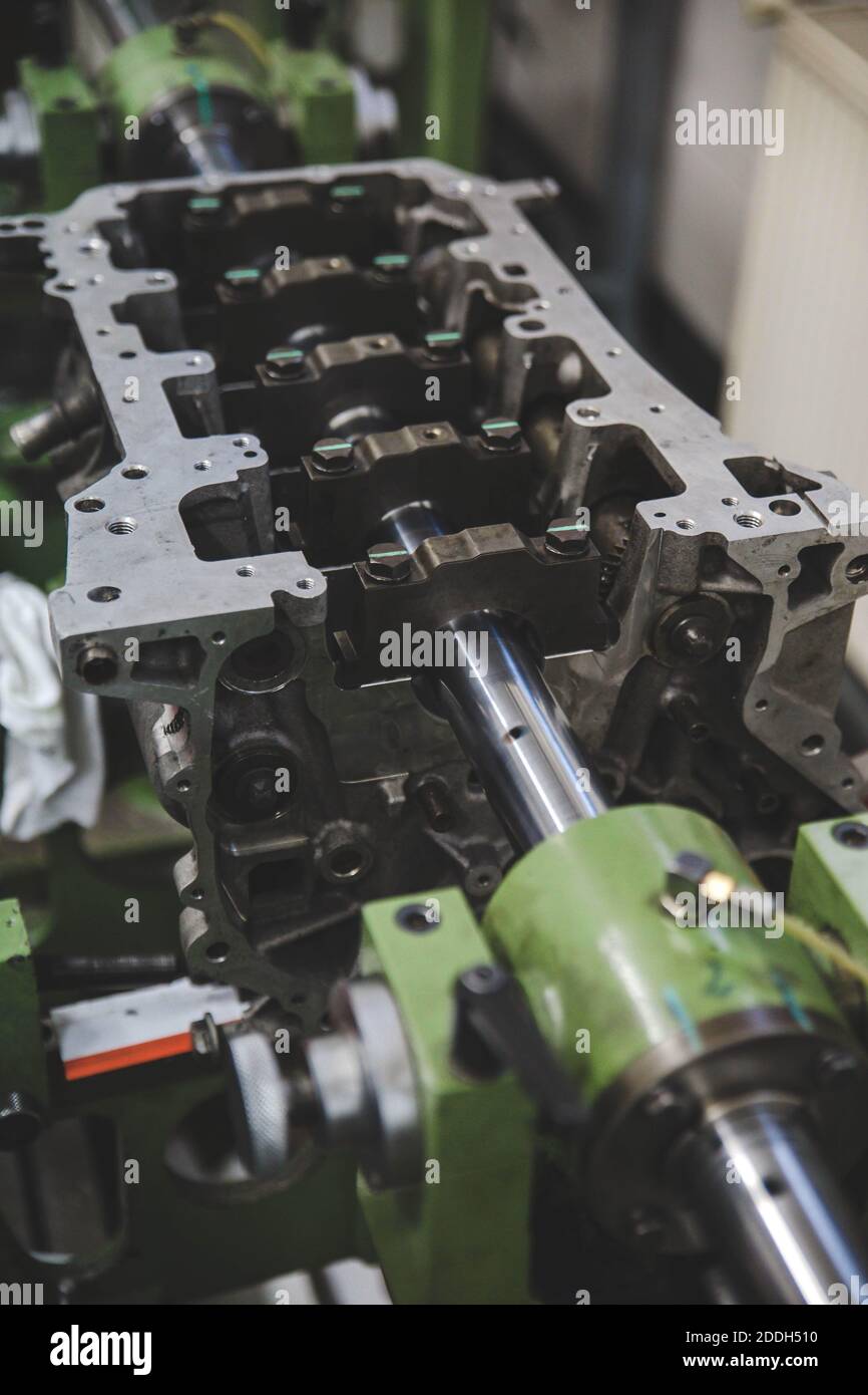 A vertical shot of a dimension aluminum automotive parts in an ...
