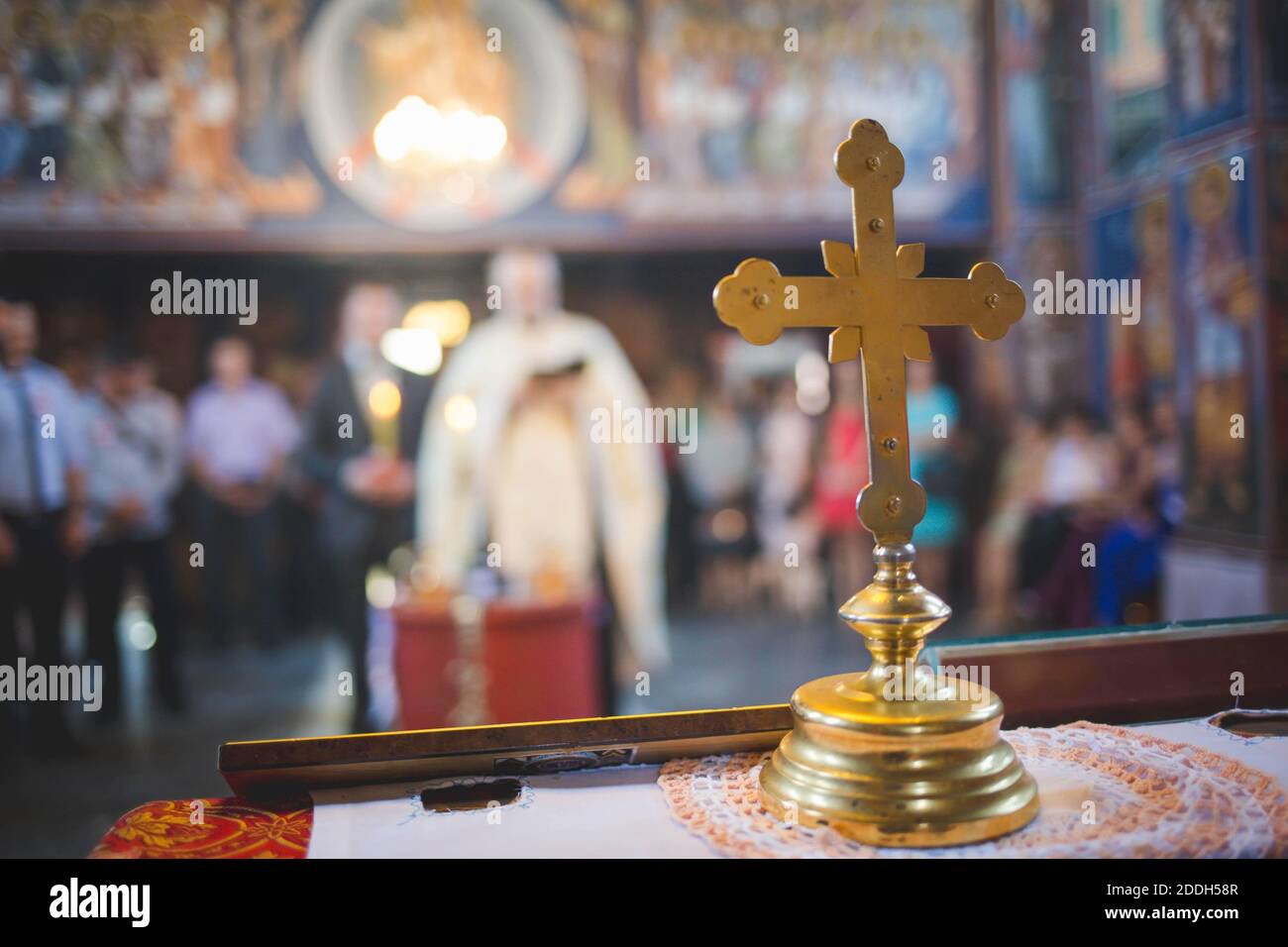 A selective focus shot of a Sanctification Cross on a blurred ...