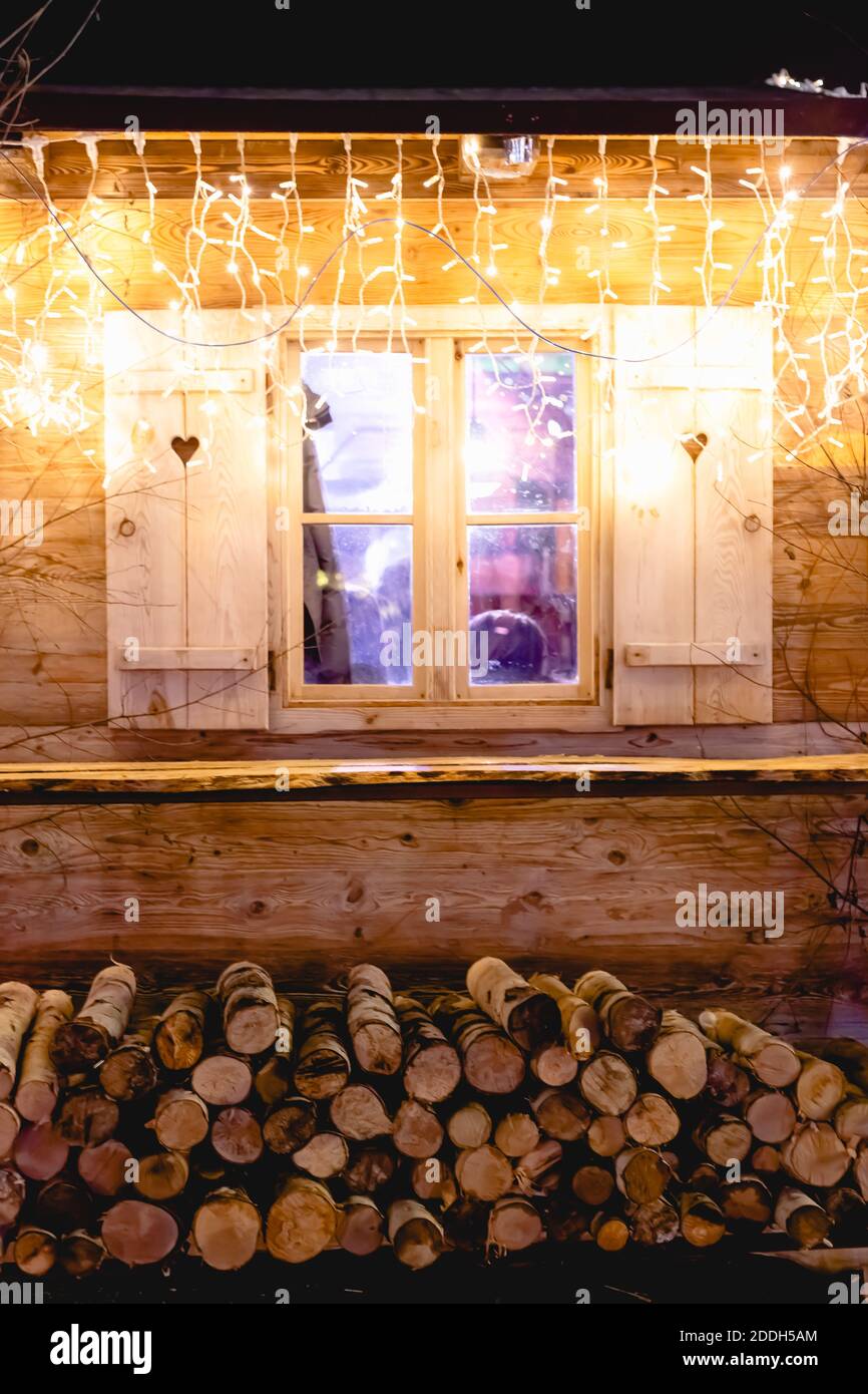 Wooden cabin window in christmas eve night. New year christmas fair ...